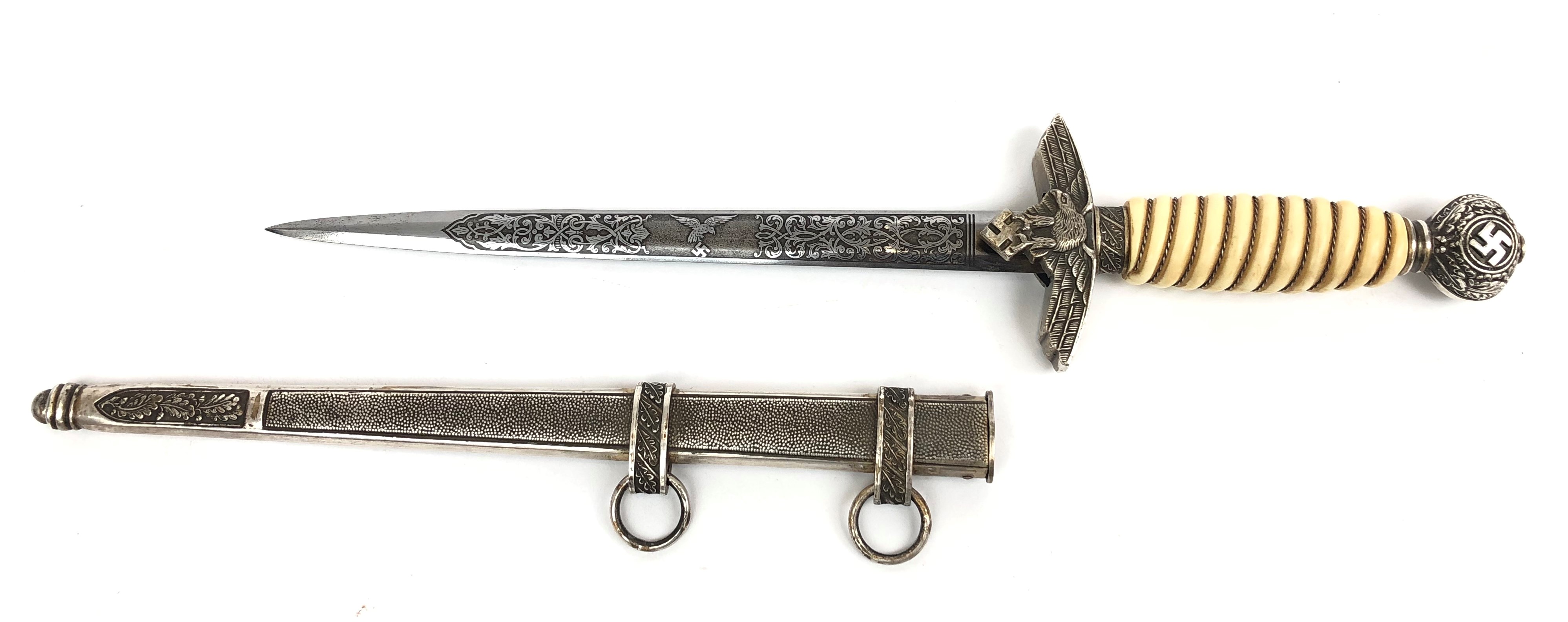 A Nazi German army officers dagger, with swastika, eagle and leaf ...