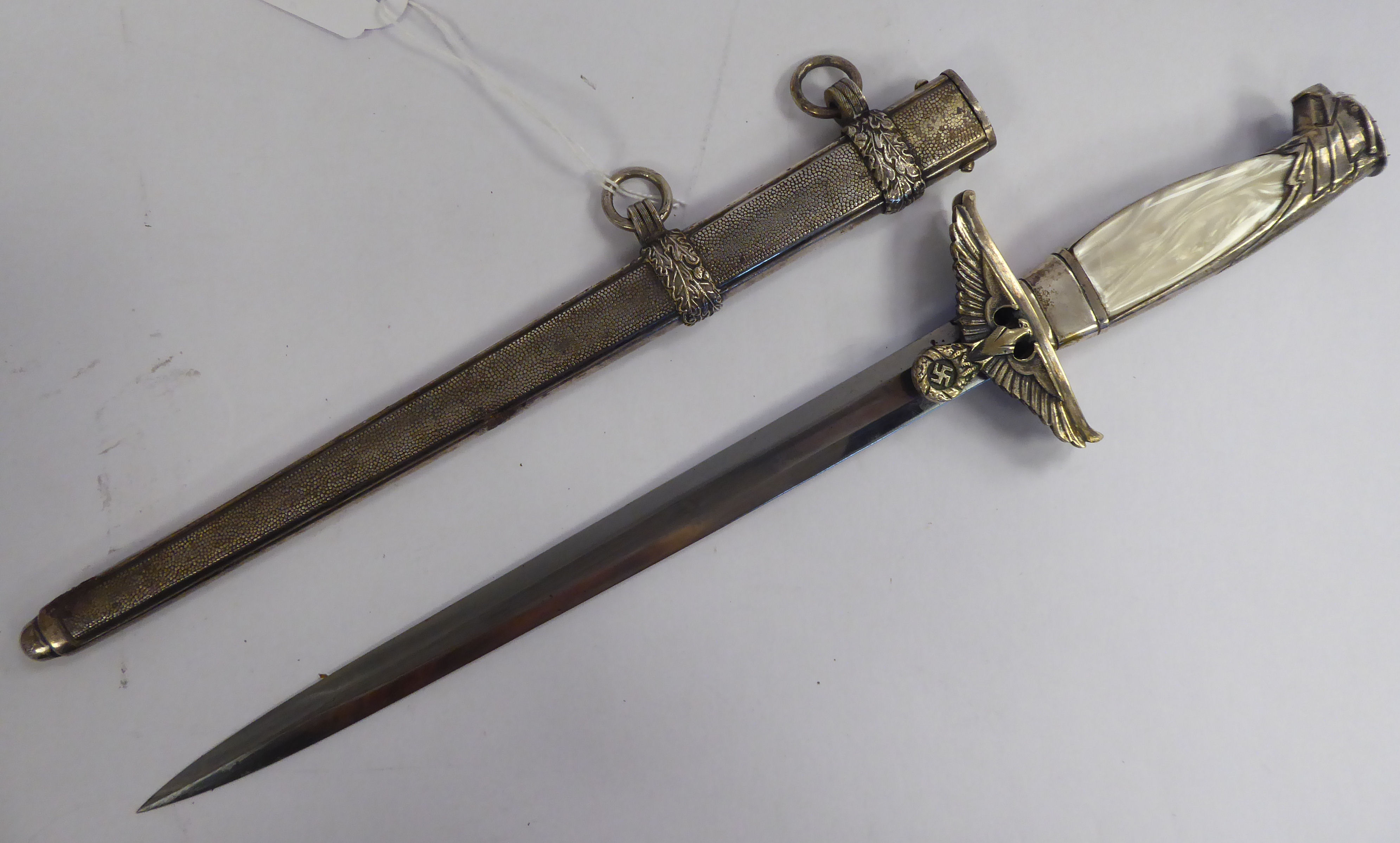 A German diplomat's dagger with an eagle's head pommel. a mother-of ...