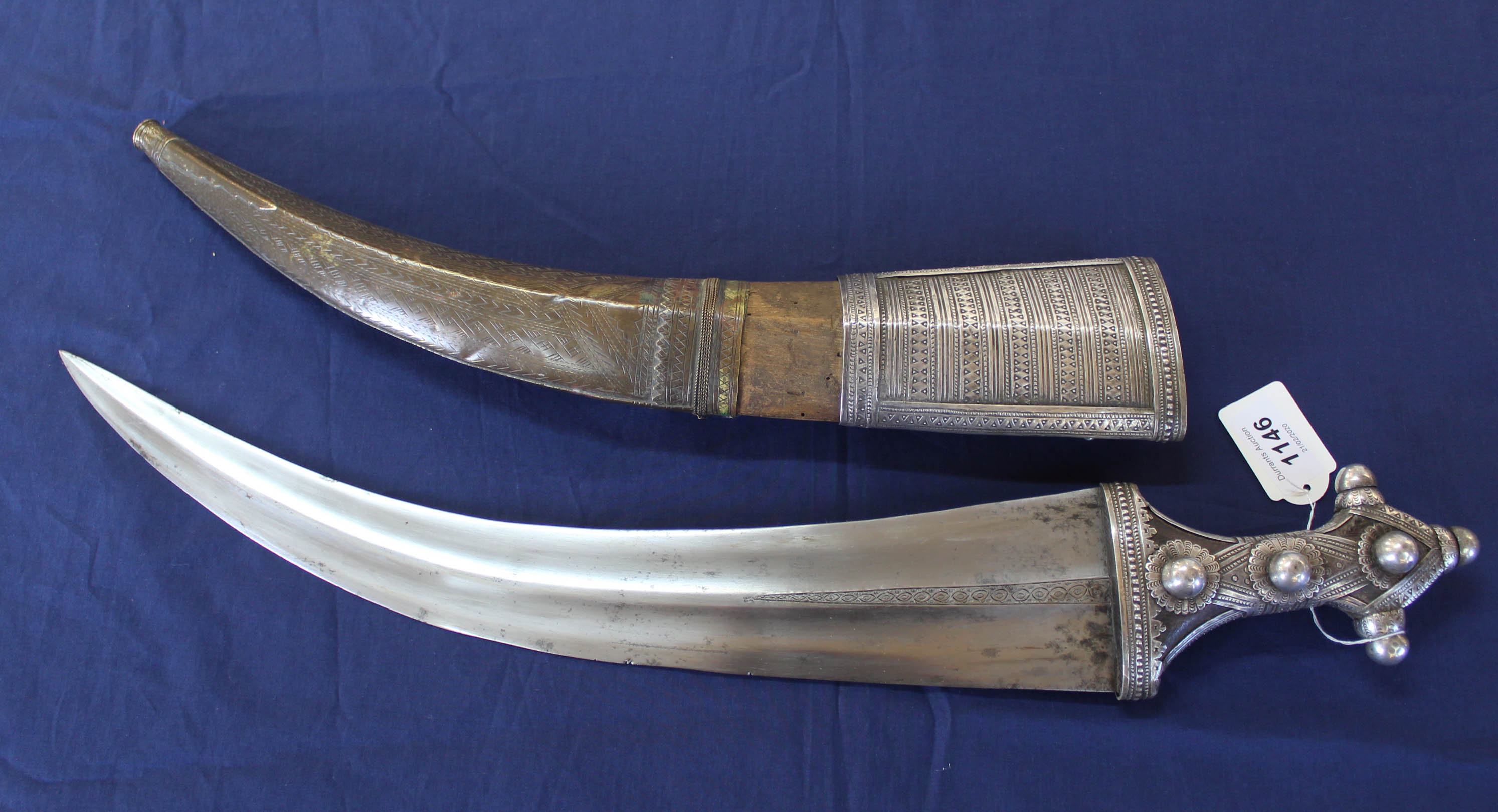 A large Middle Eastern Khanjar (blade 17 1/2") with scabbard, some ...