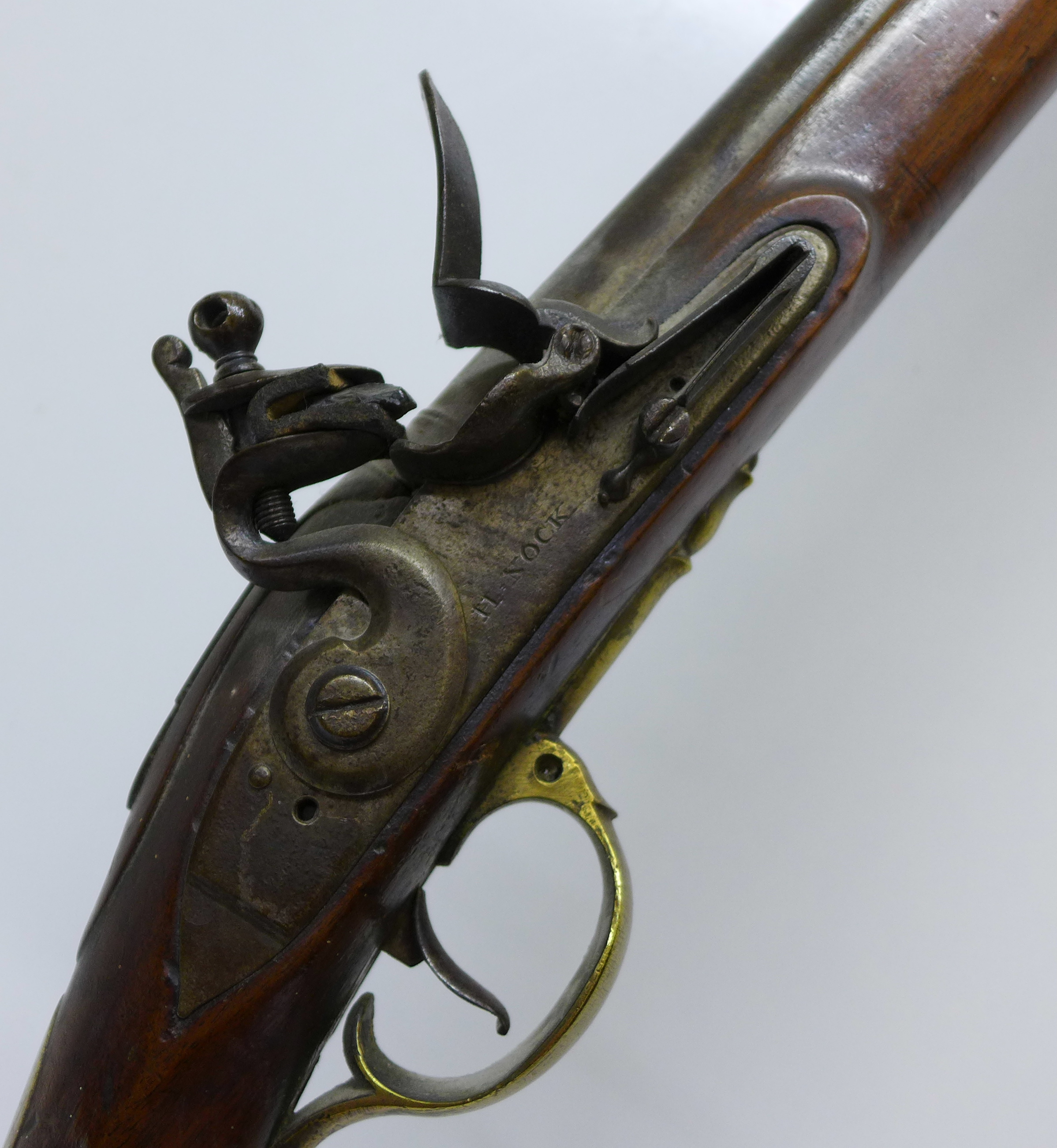 An early 19th Century flintlock carbine rifle by Henry Nock, the lock ...