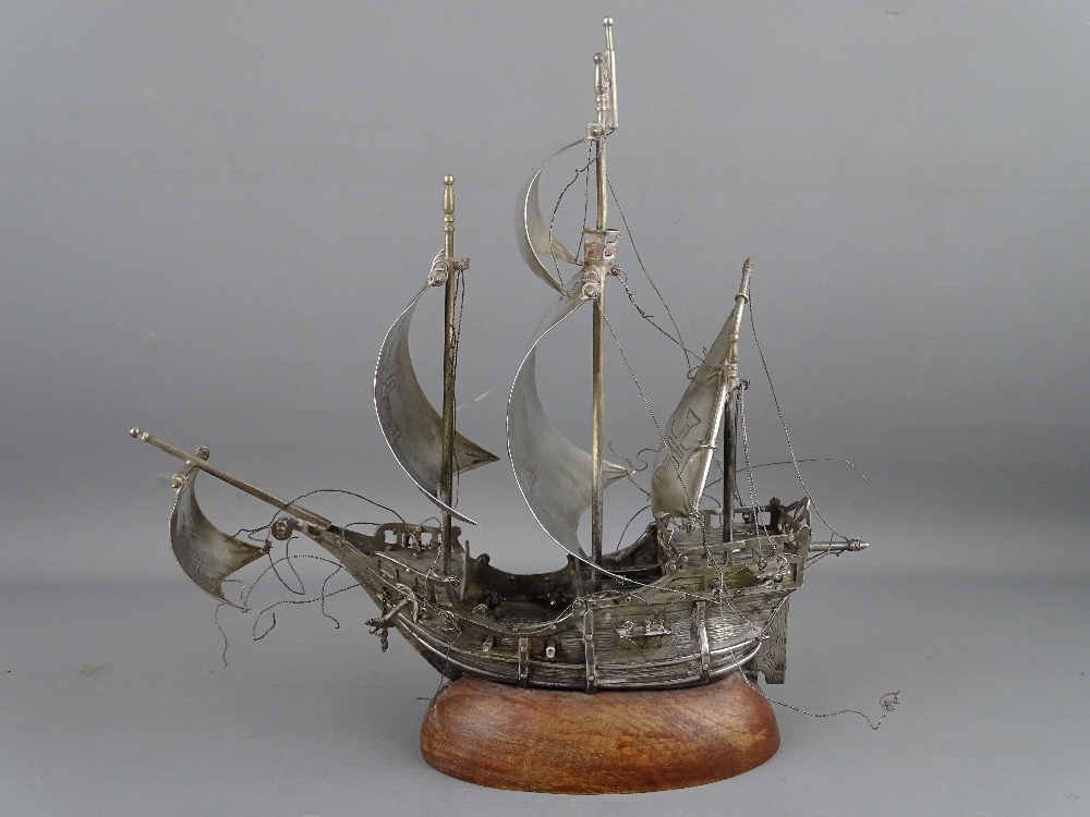 A PORTUGUESE SILVER GALLEON mounted on a wooden base, stamped to the ...