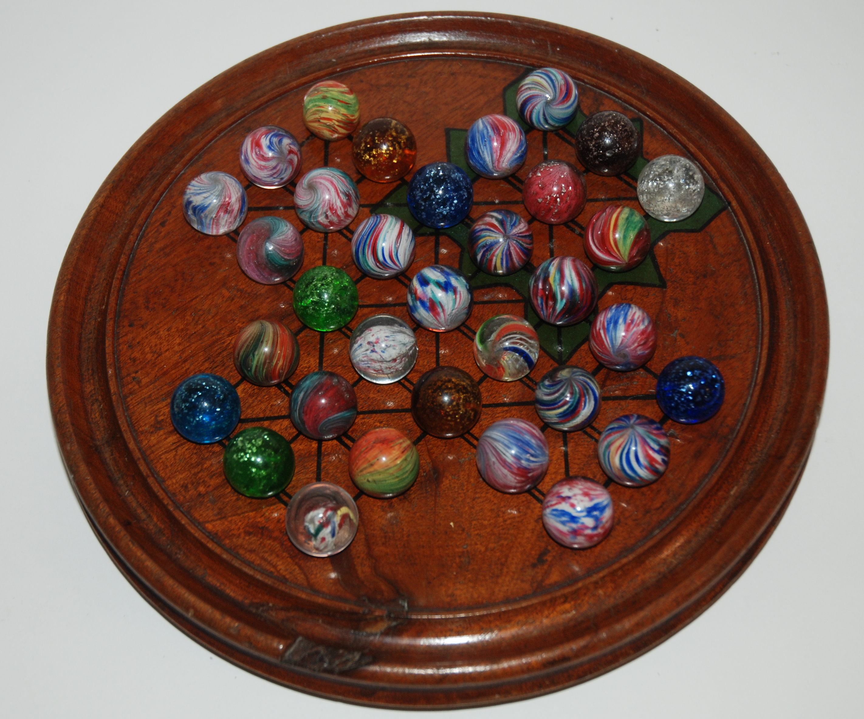 A COLLECTION OF VICTORIAN MARBLES approx 2cm diameter on turned wood ...