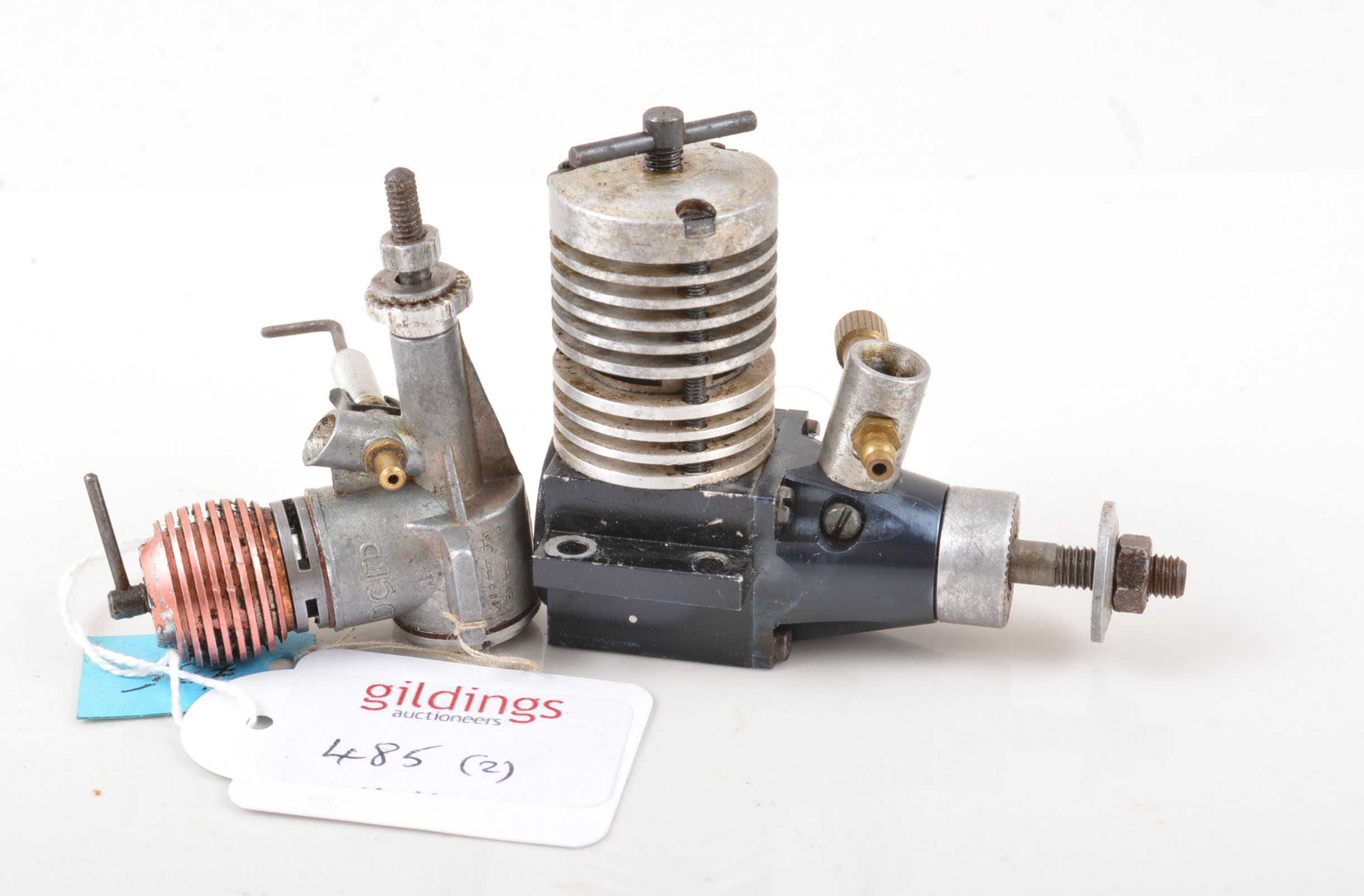 Two diesel engines AE 1.5cc, in a box with papers and DC DART .5cc.