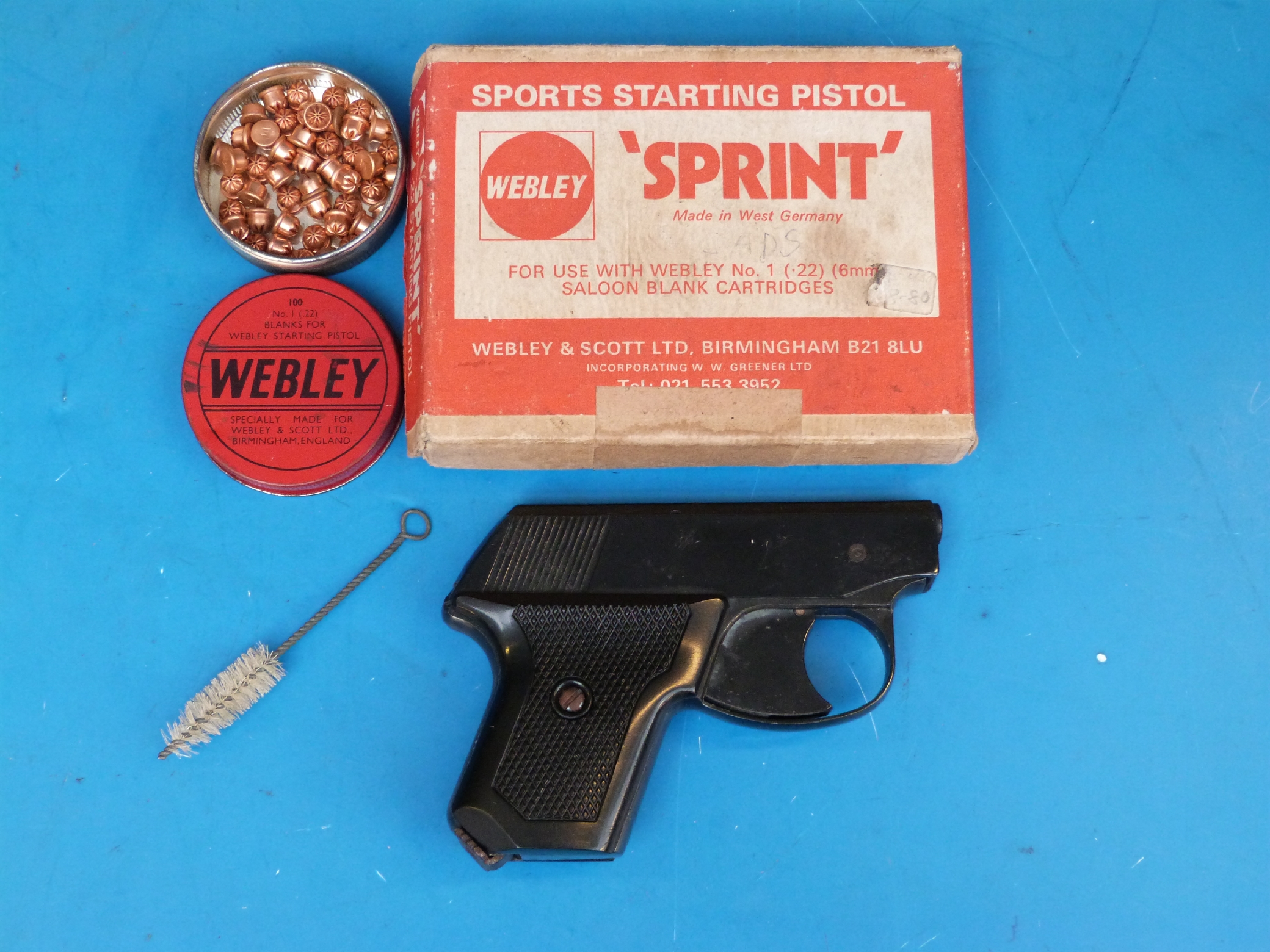 A Webley & Scott 'The Sprint' starting gun with caps and brush in ...