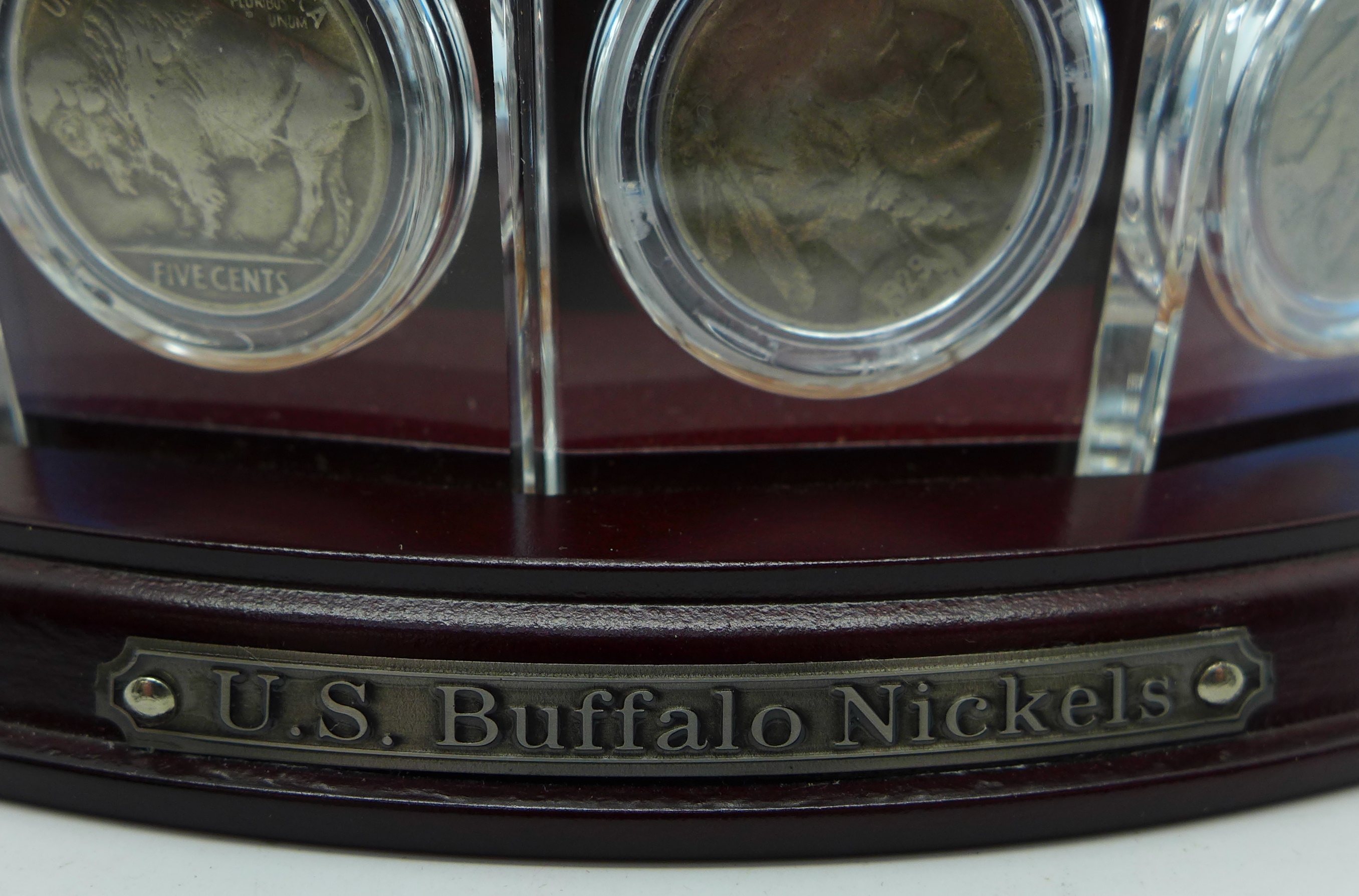A Danbury Mint Buffalo Nickels Crystal Collection on a turntable stand