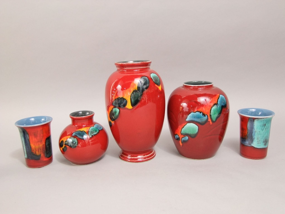 A collection of Poole pottery vases all with red, orange and turquoise ...