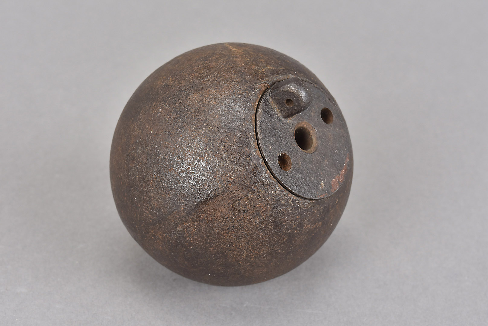 A early 20th century round hand grenade, possibly American ...