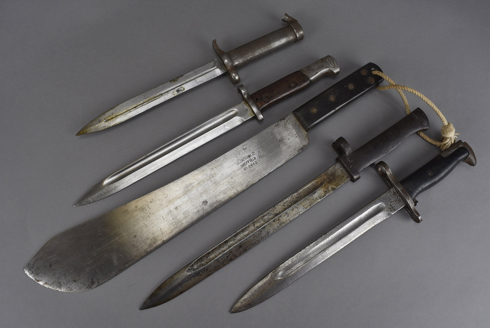 A group of four WWII bayonets, comprising an Austrian short carbine ...