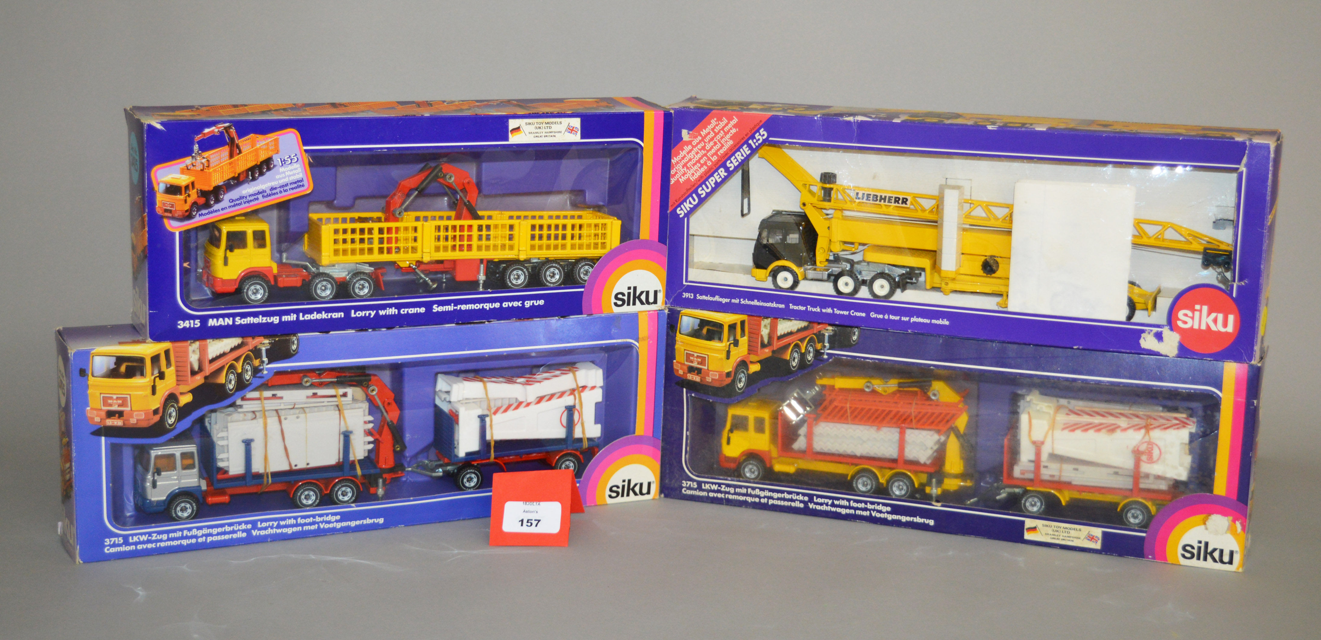 Four Siku 1:55 scale diecast models: 3913 Tractor Truck with Tower Crane; 3415 Lorry with Crane;