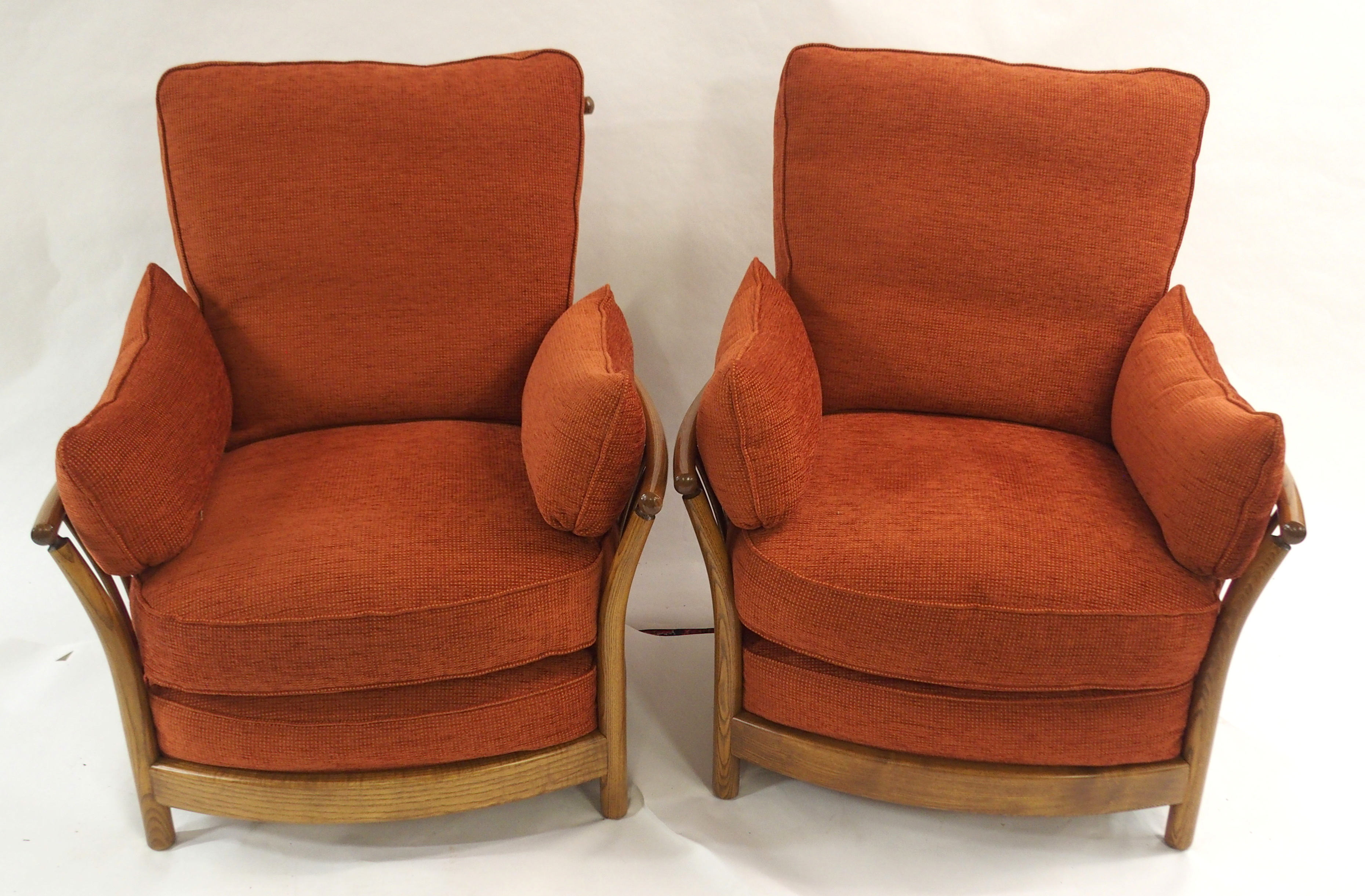 AN ERCOL RENAISSANCE TERRACOTTA UPHOLSTERED THREE PIECE SUITE ...