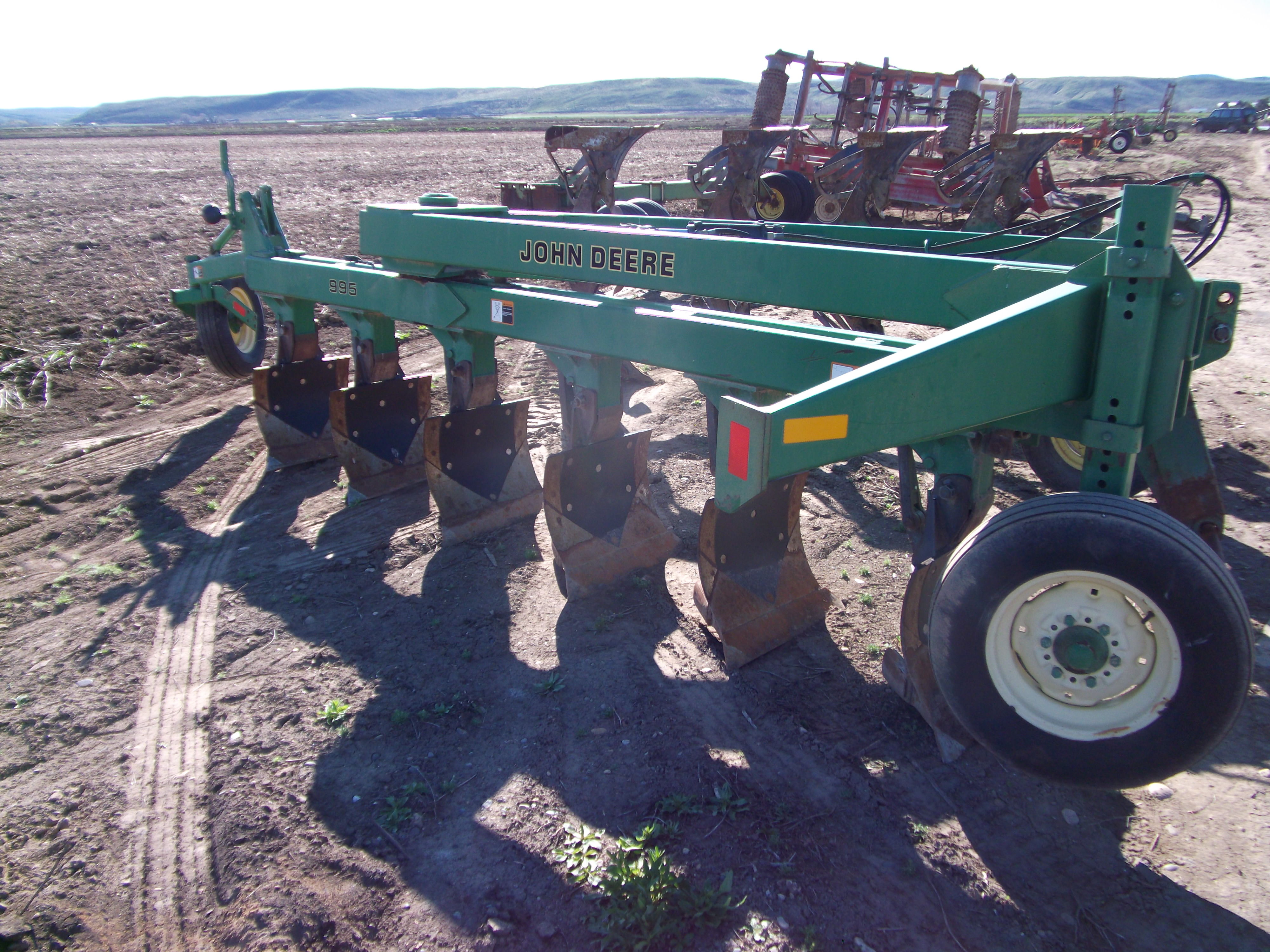 JD 995 switch plow 6 bottom on land