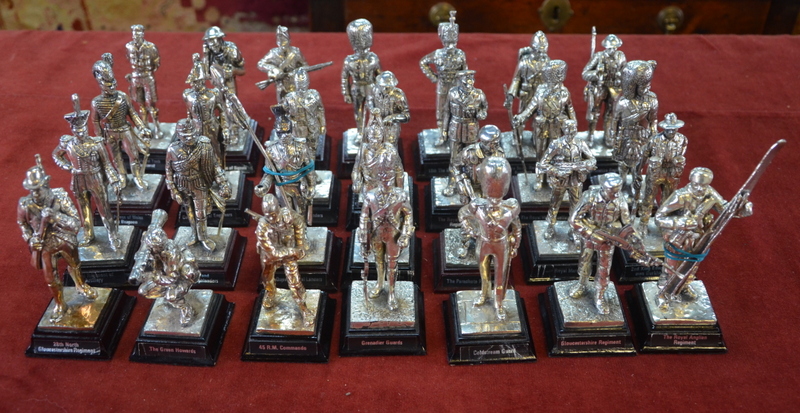 A collection of 28 polished pewter figures - British military uniforms ...