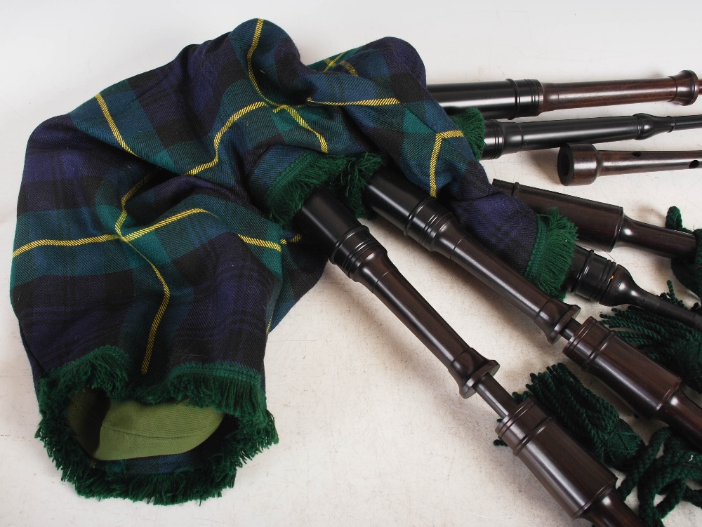 A set of bagpipes, PIOB MHOR, with tartan bag.