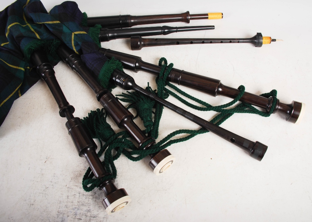 A set of bagpipes, PIOB MHOR, with tartan bag.