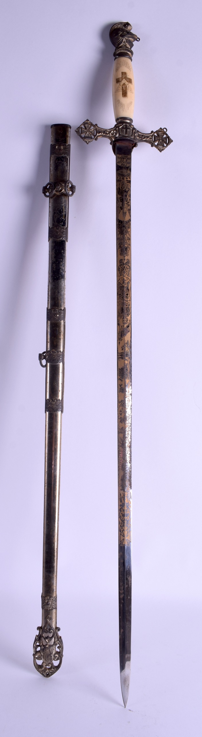 A 19TH CENTURY MASONIC CARVED IVORY HANDLED SWORD decorated with a ...