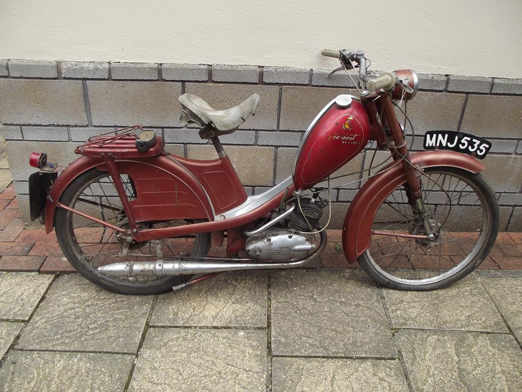 A 1957 Phillips Gadabout moped, registration number MNJ 535, red ...