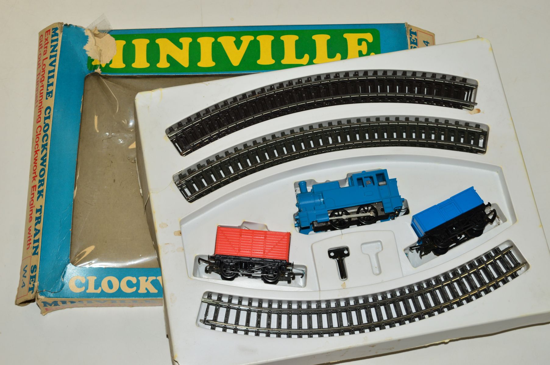 A BOXED TRI-ANG MINIVILLE OO GAUGE CLOCKWORK TRAIN SET, No.W.4 ...