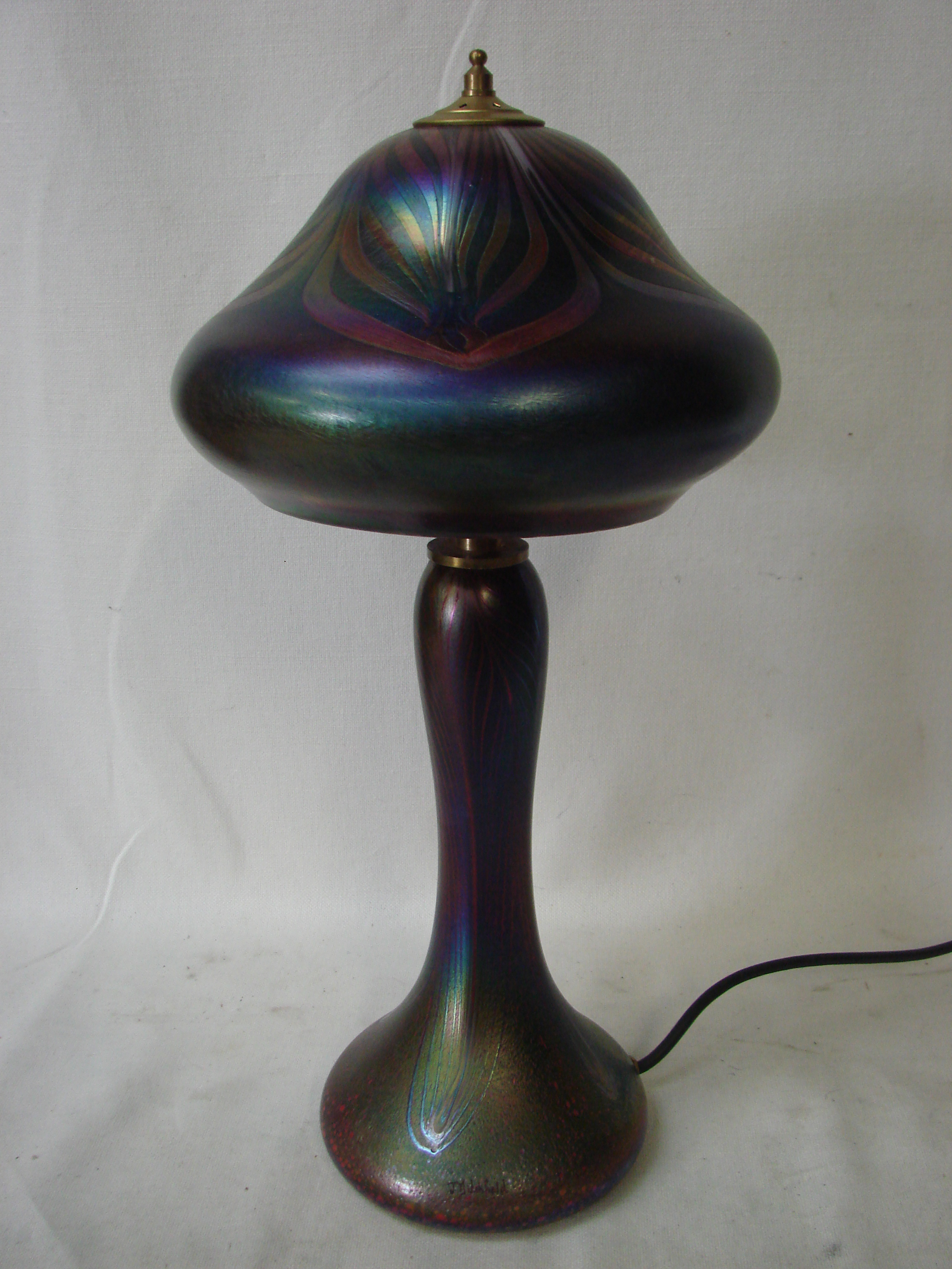 A glassform table lamp and shade by John Ditchfield, iridescent blue of ...