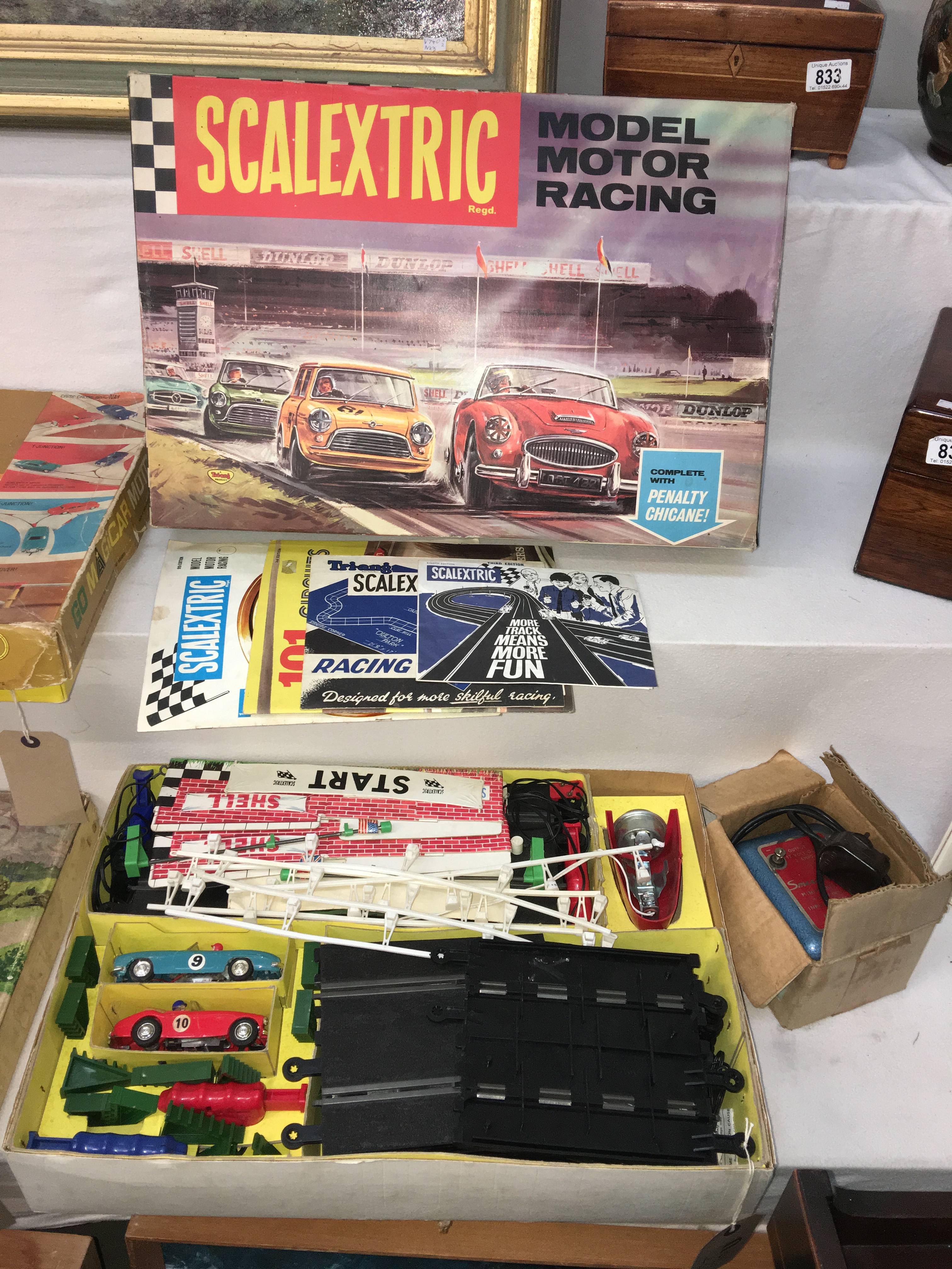 A Scalextric set 65 motor racing set. Looks complete with both carsNo ...