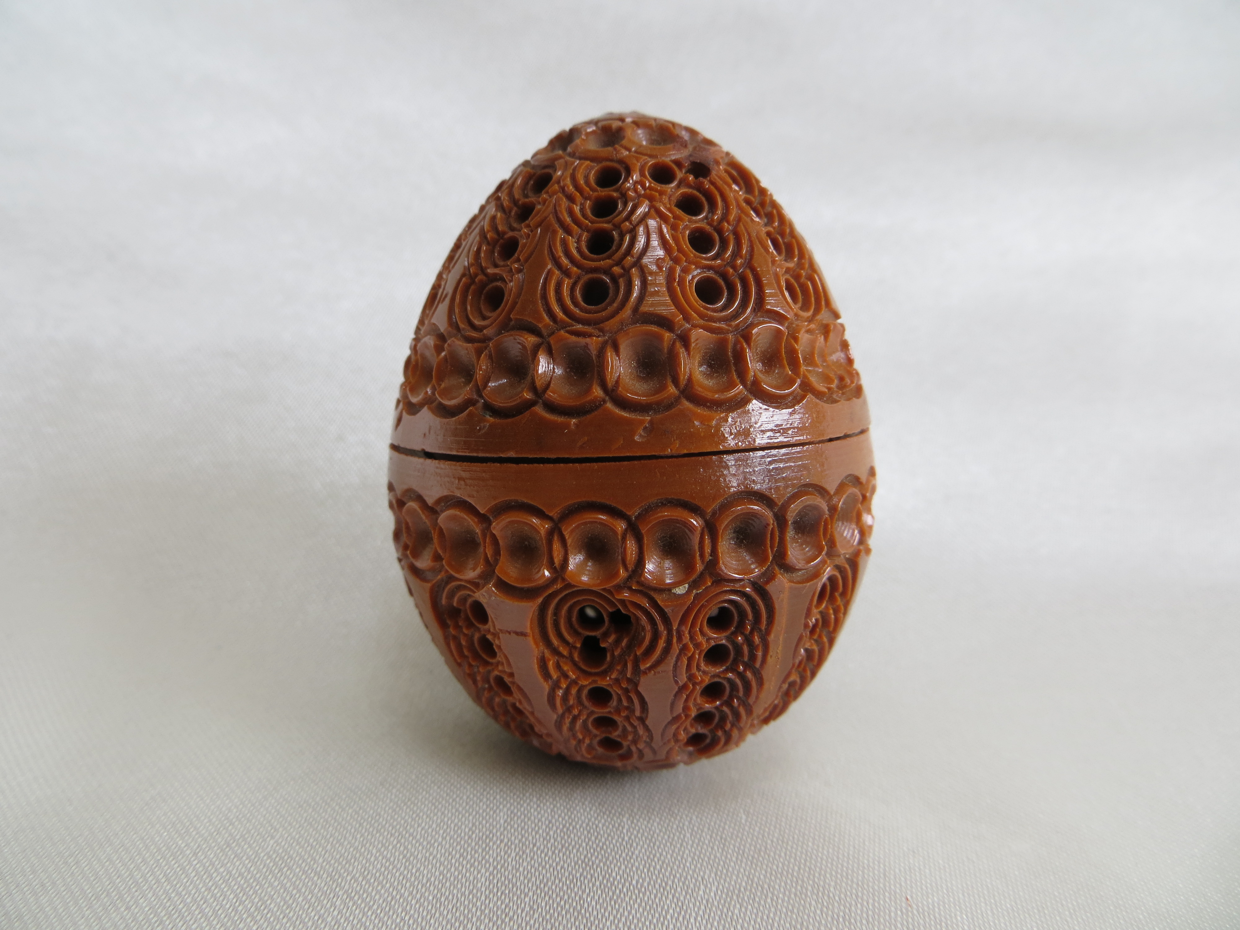 A Victorian hand carved Coquilla Nut egg pomander.