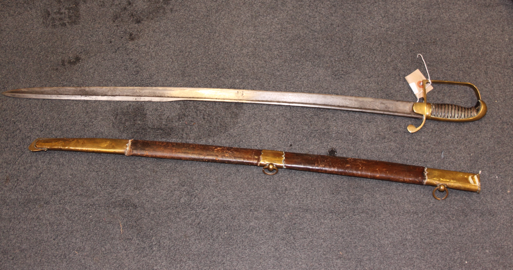 An early 19th Century cavalry sabre with simple grip and guard ...