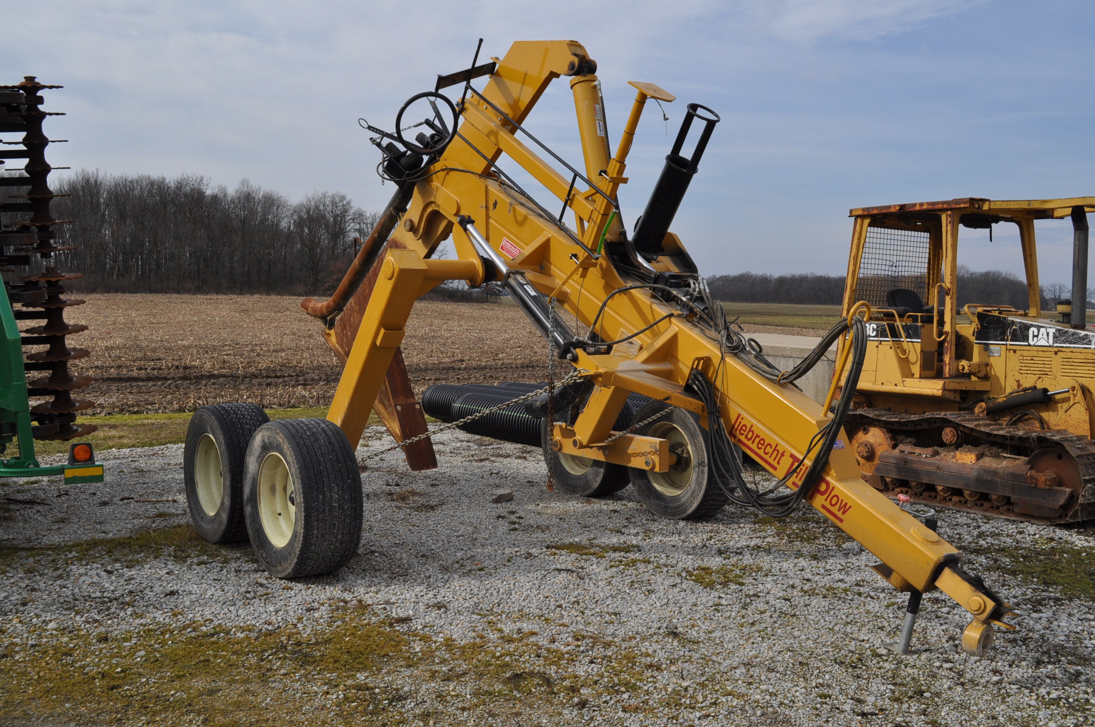 Liebrecht pull type tile plow, tandem wheel, power feeder, 4” and 8” boots