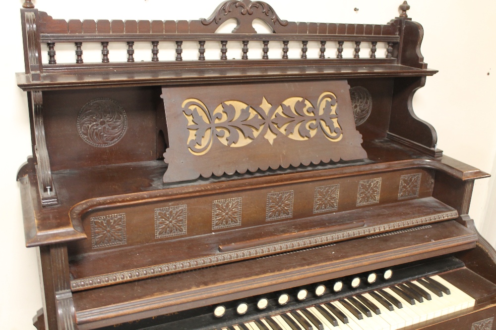 AN EARLY 20TH CENTURY BELLOWS ORGAN BY 'BELL ORGAN AND PIANO CO. LTD ...