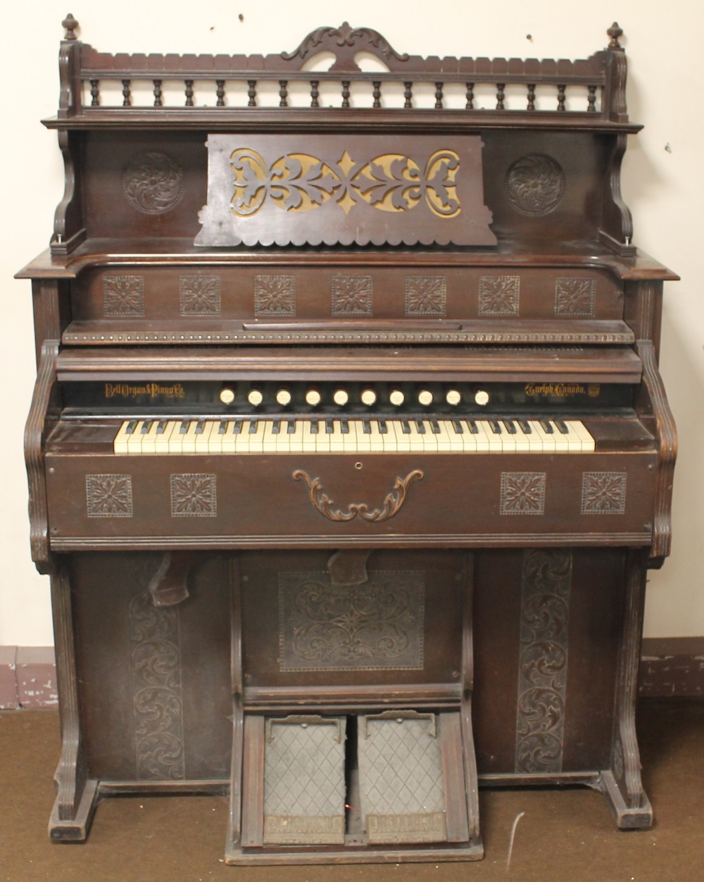 AN EARLY 20TH CENTURY BELLOWS ORGAN BY 'BELL ORGAN AND PIANO CO. LTD ...