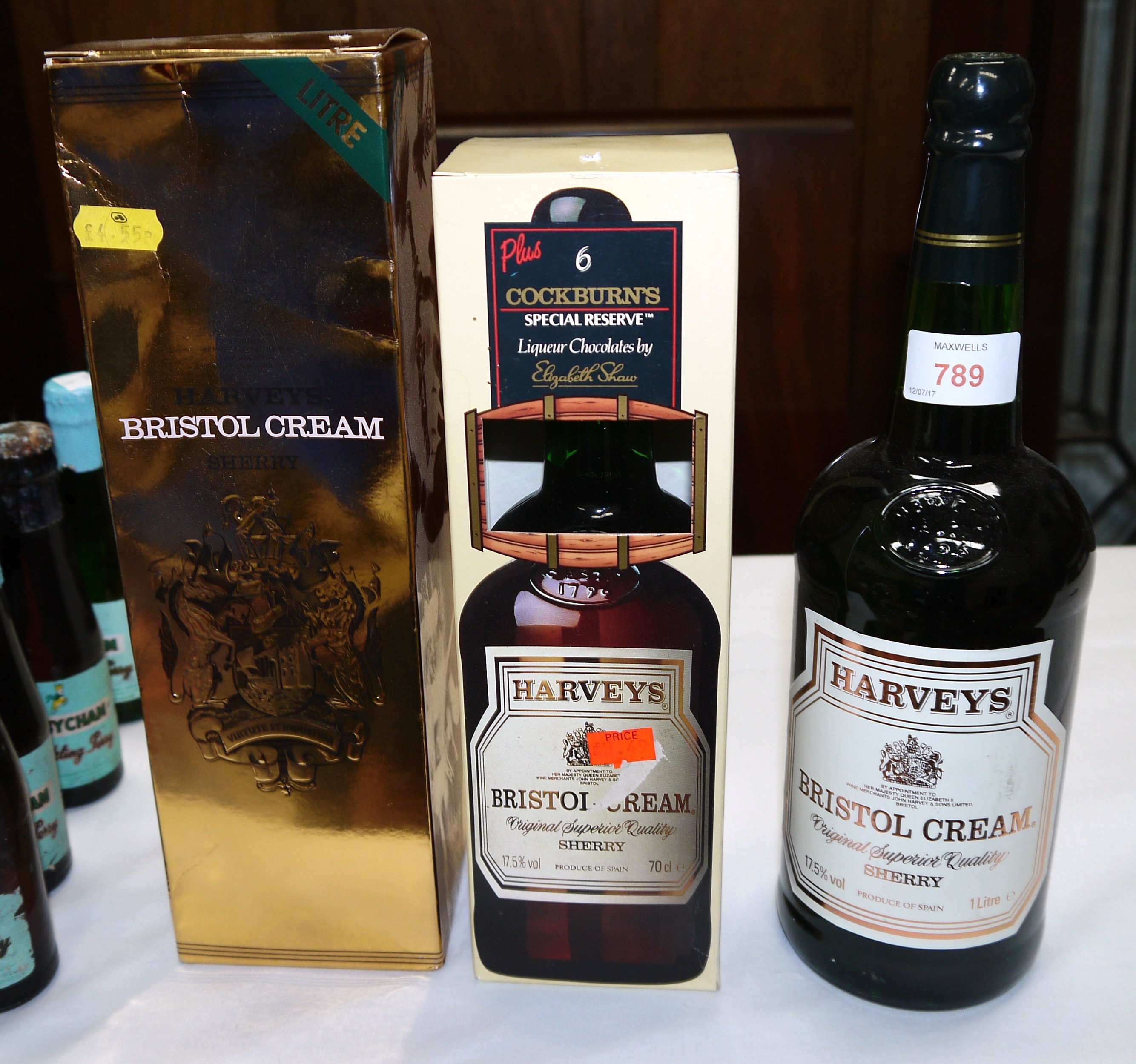 A boxed 1 litre bottle of Harvey's Bristol Cream Sherry; a similar and ...