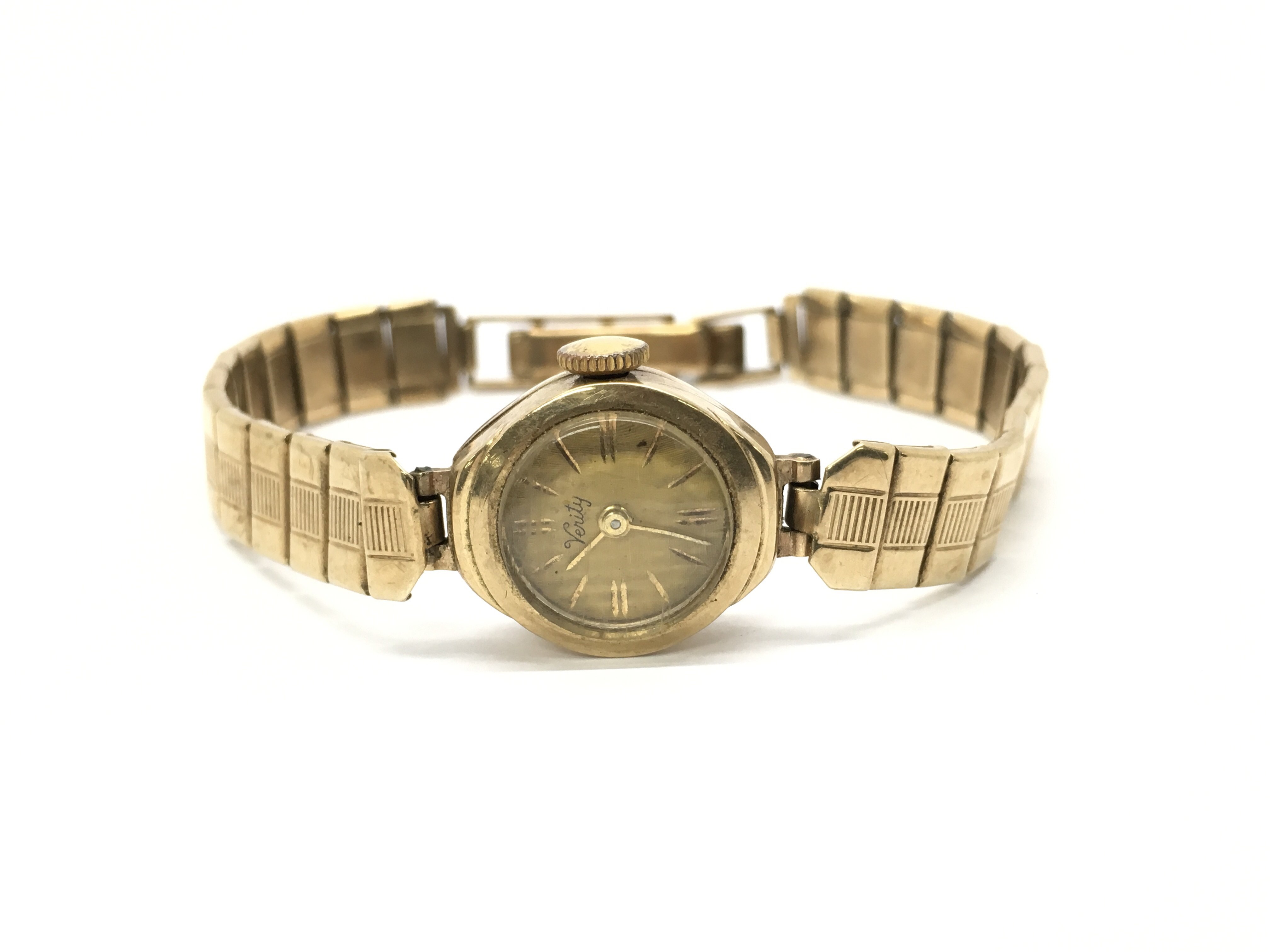 A 9ct gold cased ladies wristwatch by Verity with 9ct gold strap. Total ...
