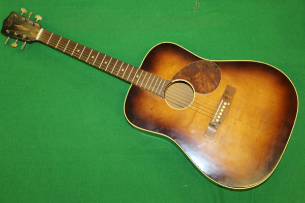 A mid 20th Century "The Hawk" accoustic guitar with simulated ivory ...