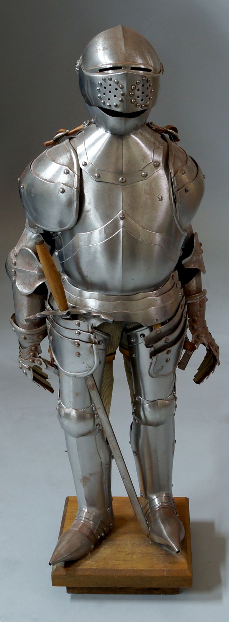 A model of suit of steel plate armour, with helmet, segmented arms and ...