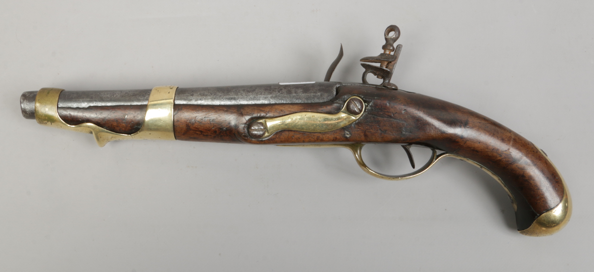 An 18th century French military Flintlock brass mounted pistol ...