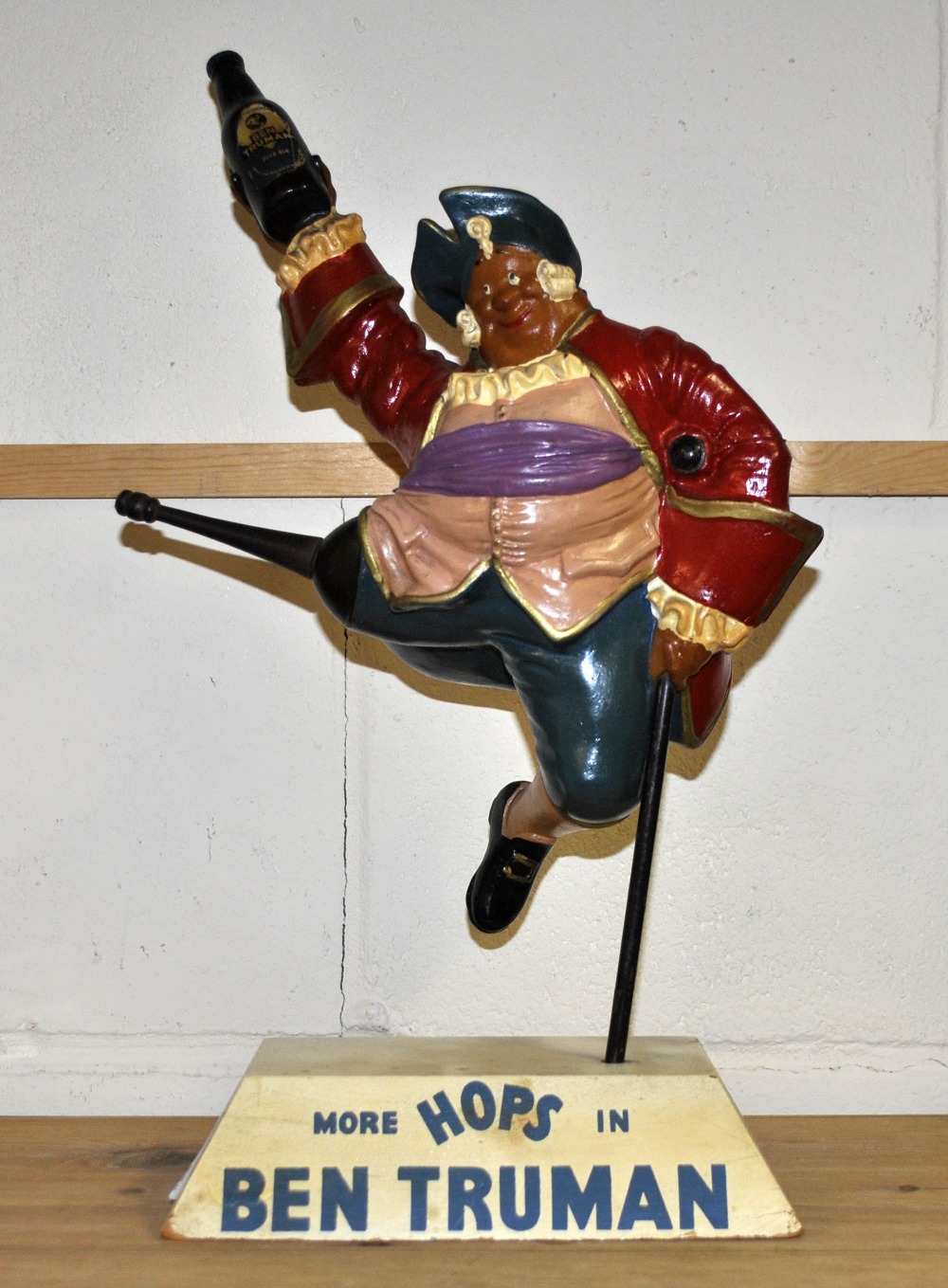 A vintage Ben Truman advertising figure, H. 37cm.
