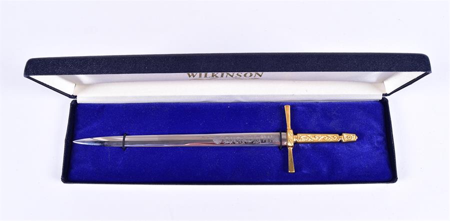A cased Wilkinson Sword presentation dagger with turned and polished ...