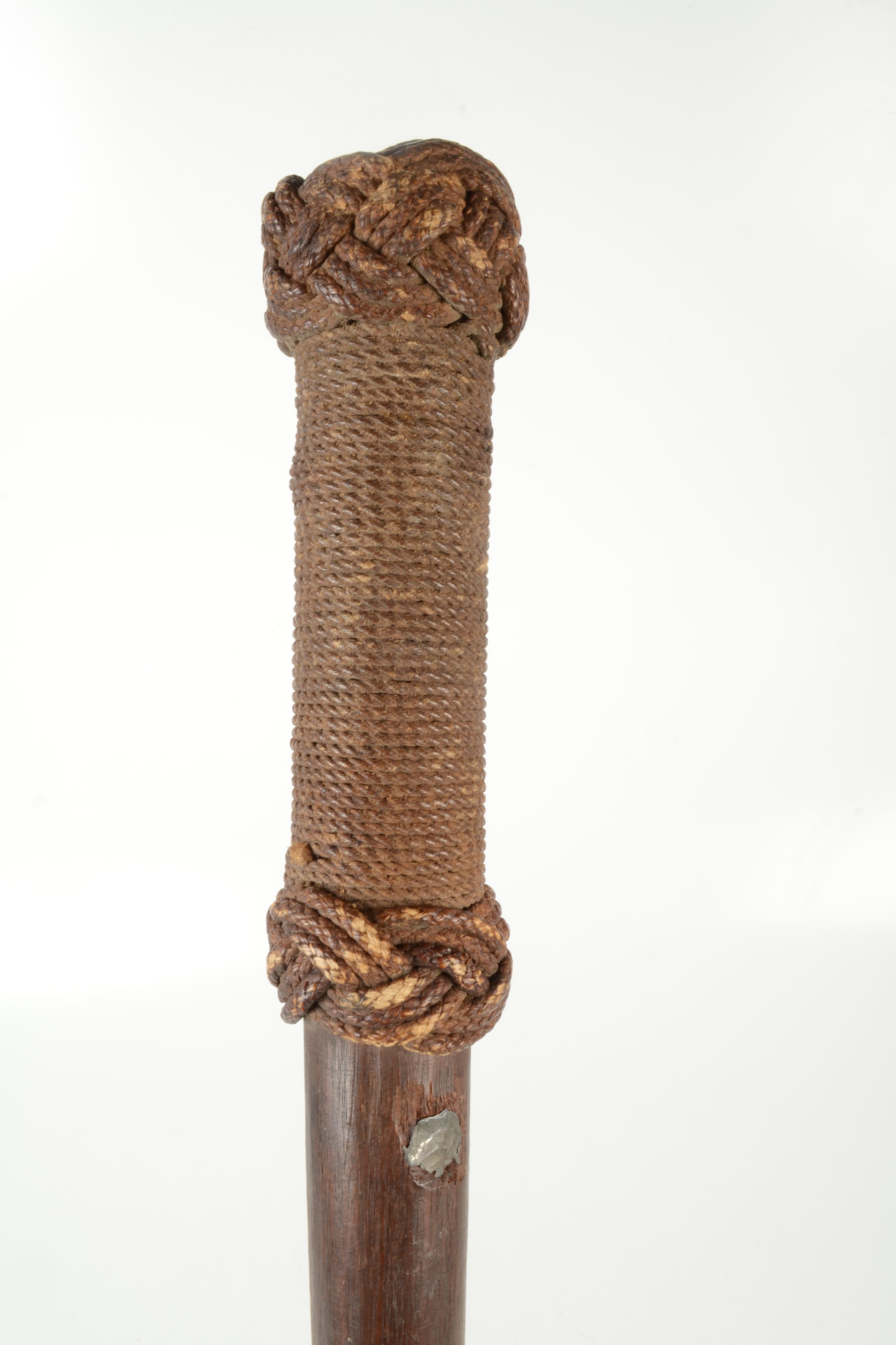 A wooden cosh, weighted and with cord braiding, length 60cm.