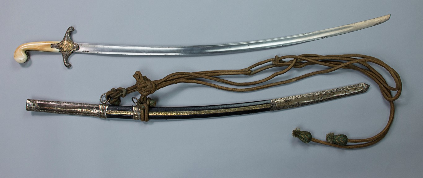 A 19th century Persian sword (Shamshir), curved 79cm blade, florally ...