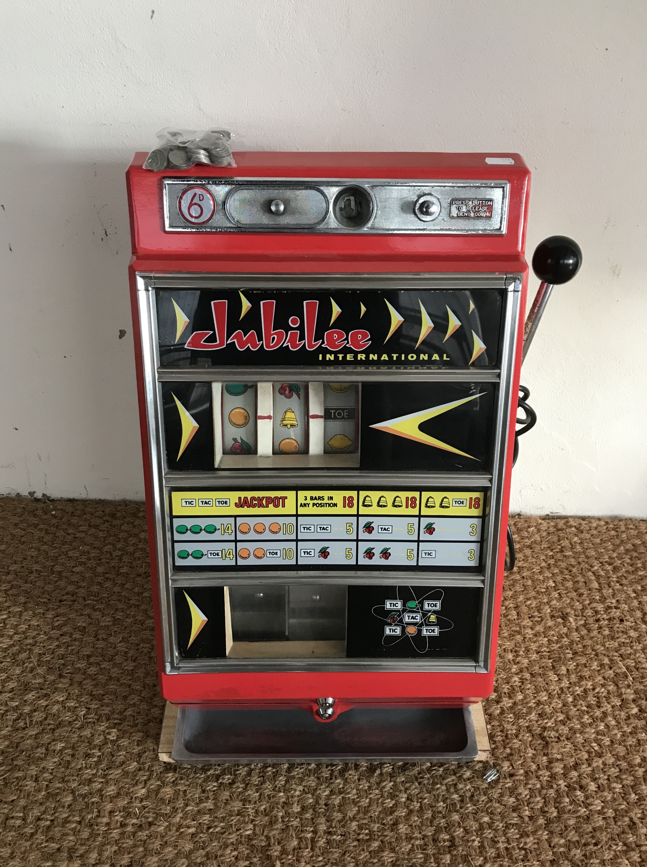 A Jubilee International one armed bandit fruit machine, 66 cm