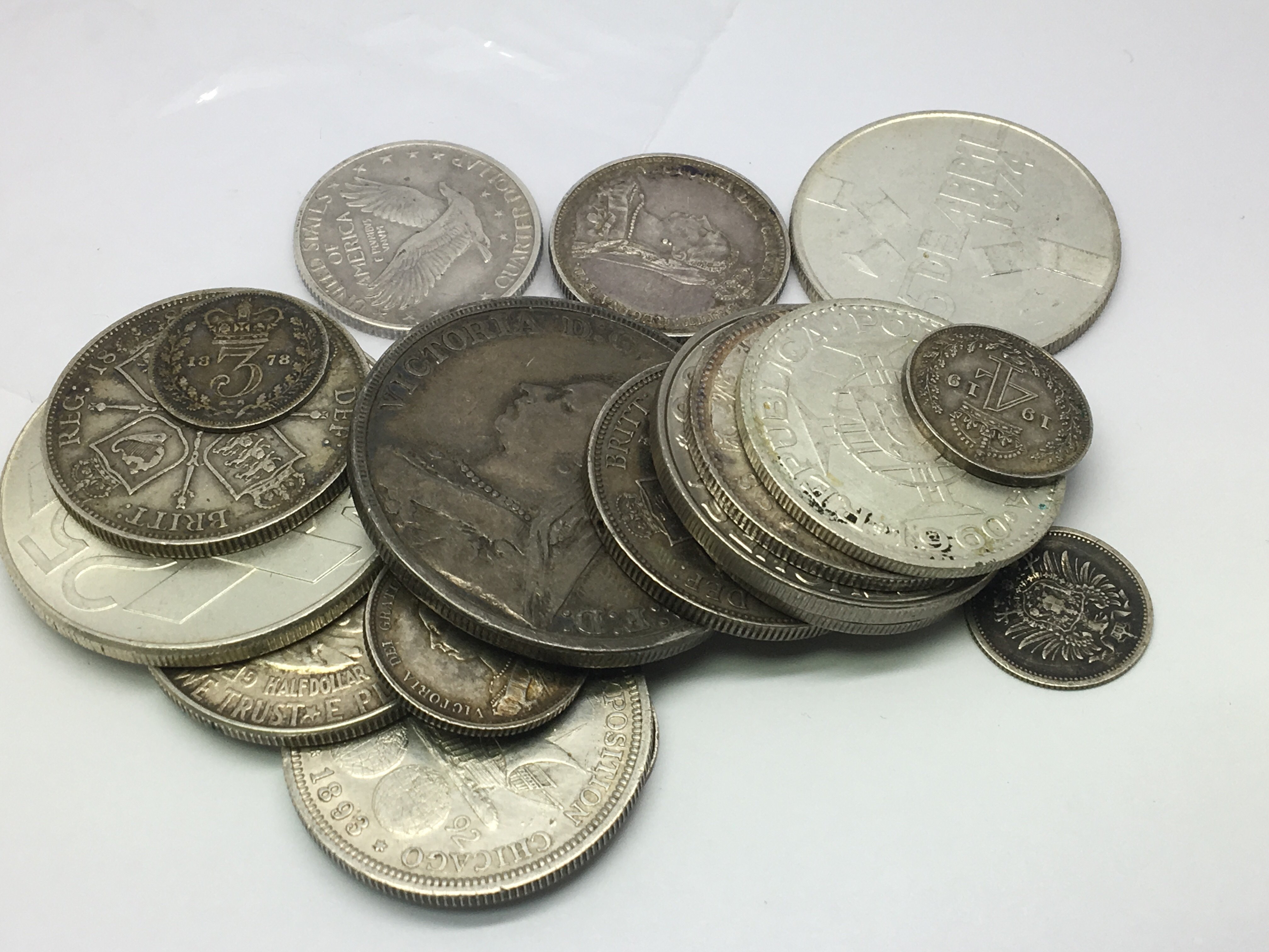 A small collection of silver coins including US