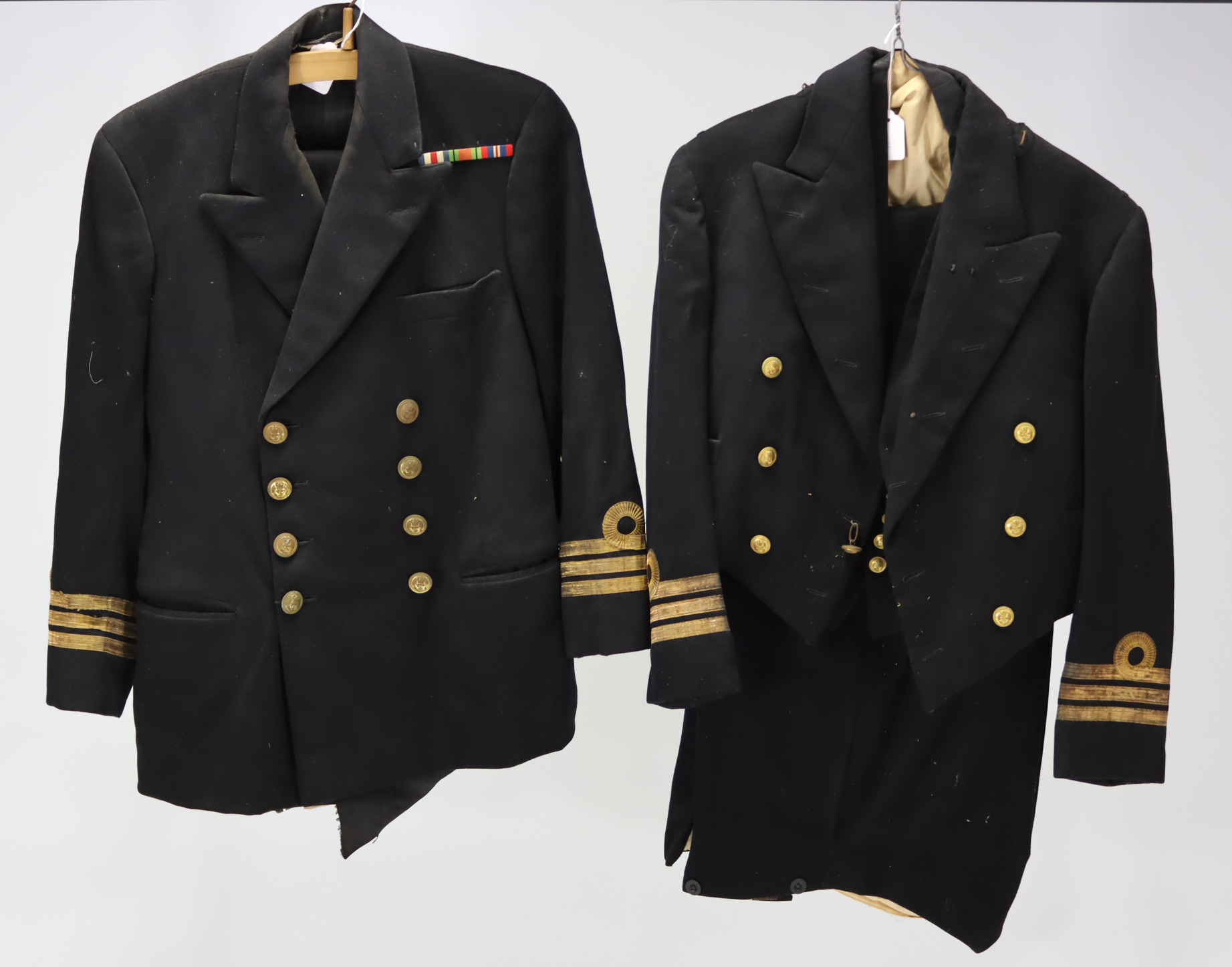 Four WWII British Navy Captain’s dress uniforms.