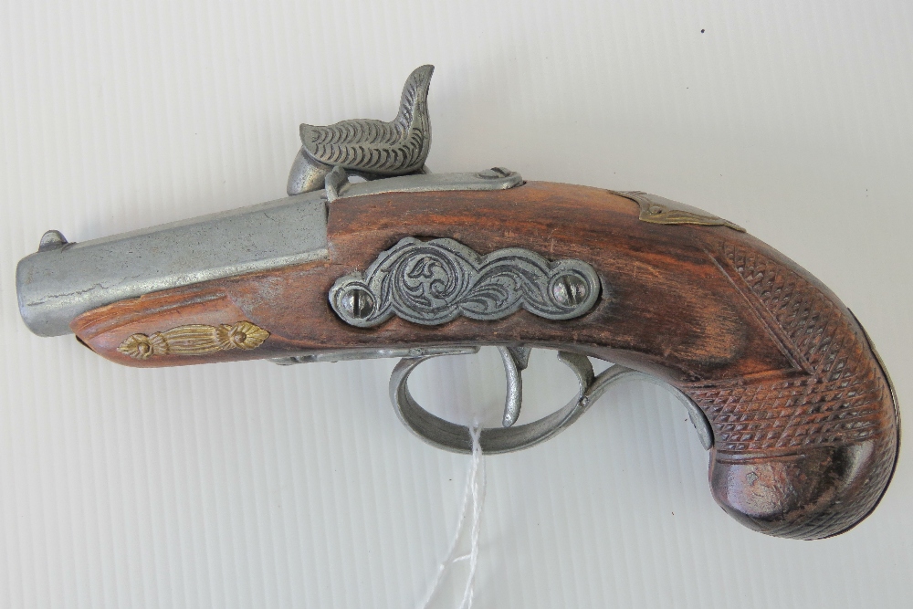 A 20th century copy of an 18th century Derringer flintlock pistol ...