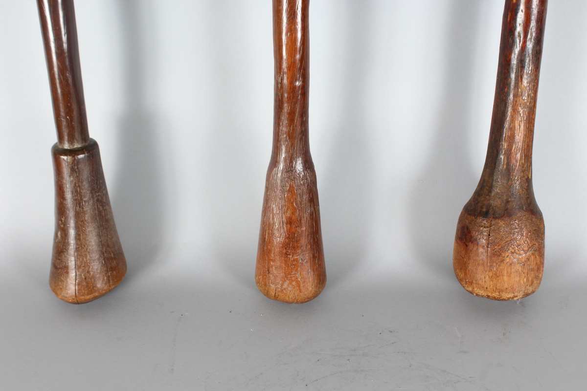 THREE HEAVY WOODEN CLUBS. 3ft 8ins, 3ft 10ins and 3ft 3ins long.