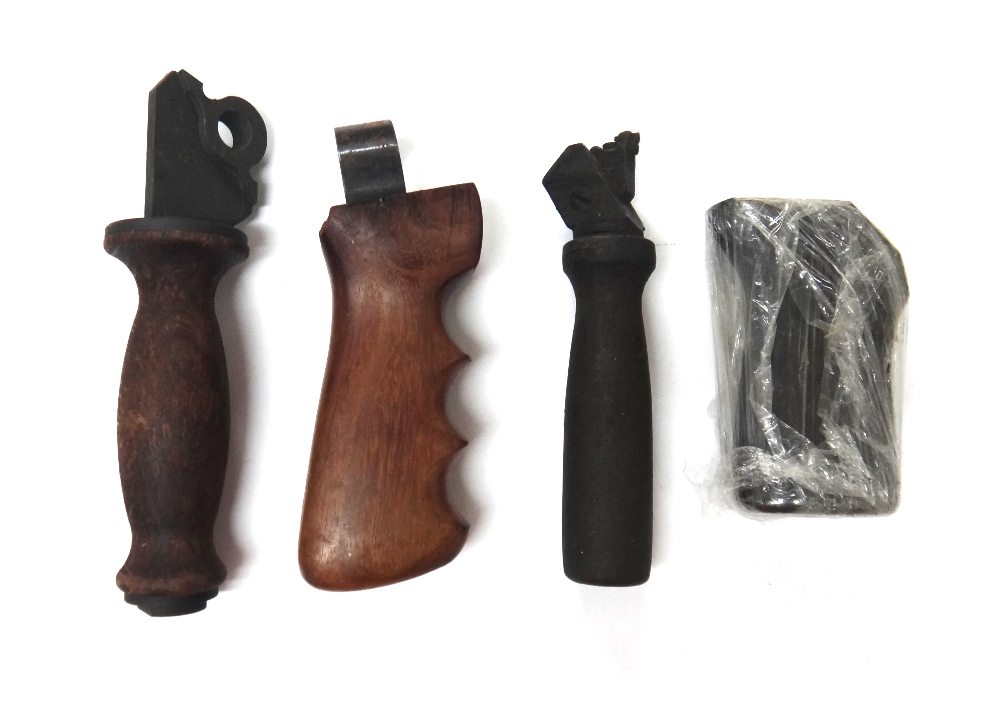 A Sten MK5 foregrip, a Bren carry handle, a pistol grip and an AA ...