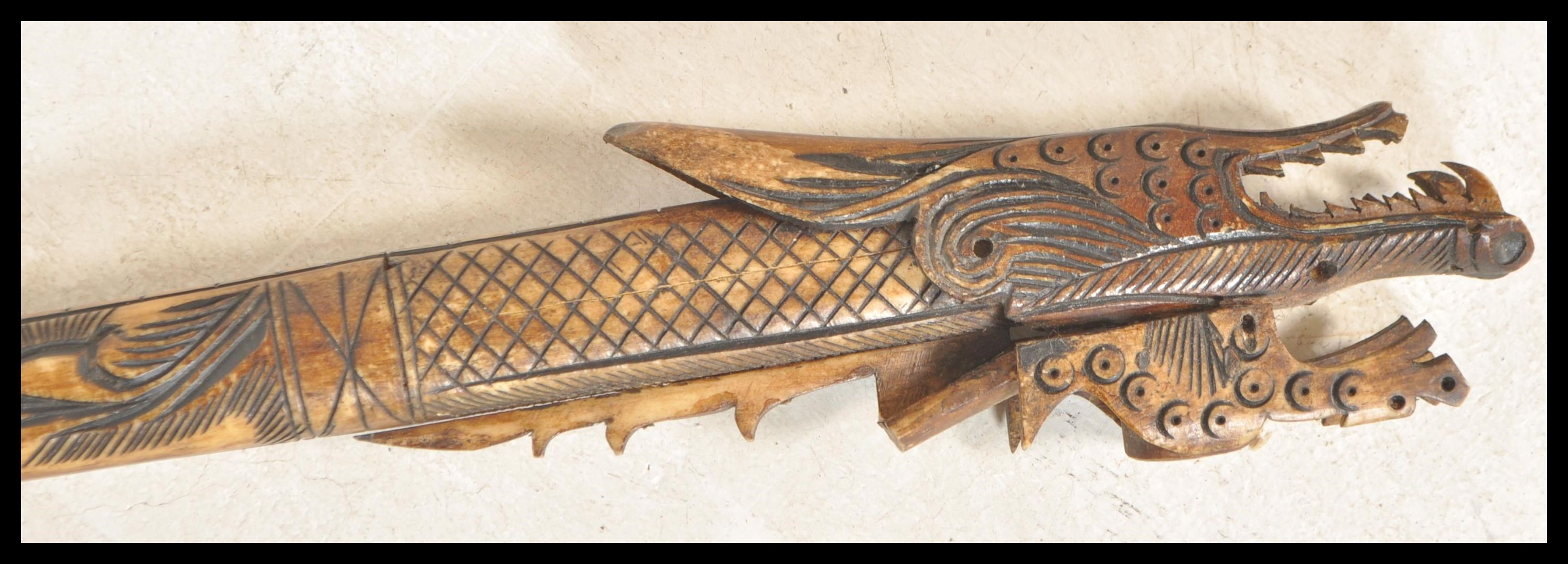 A 20th Century cast resin Chinese ceremonial staff int he form of a ...