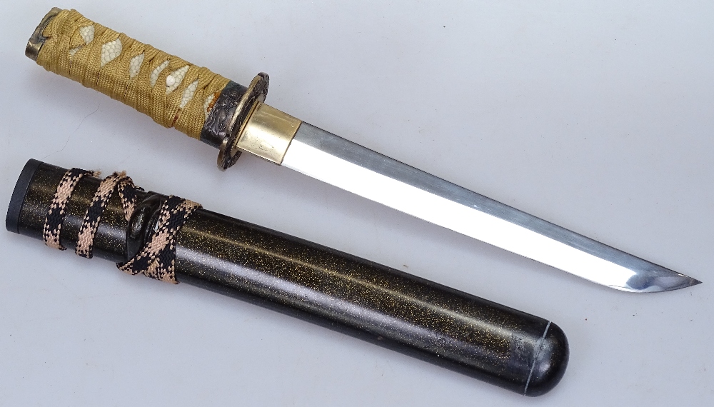 A Japanese dagger in lacquer scabbard, and a carved-horn and silver ...