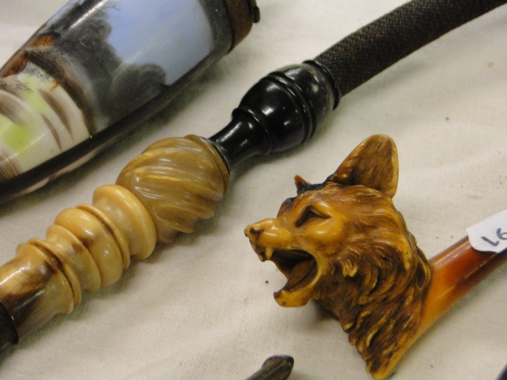 A carved fox head pipe with amber mouthpiece, Meerschaum pipes and a ...