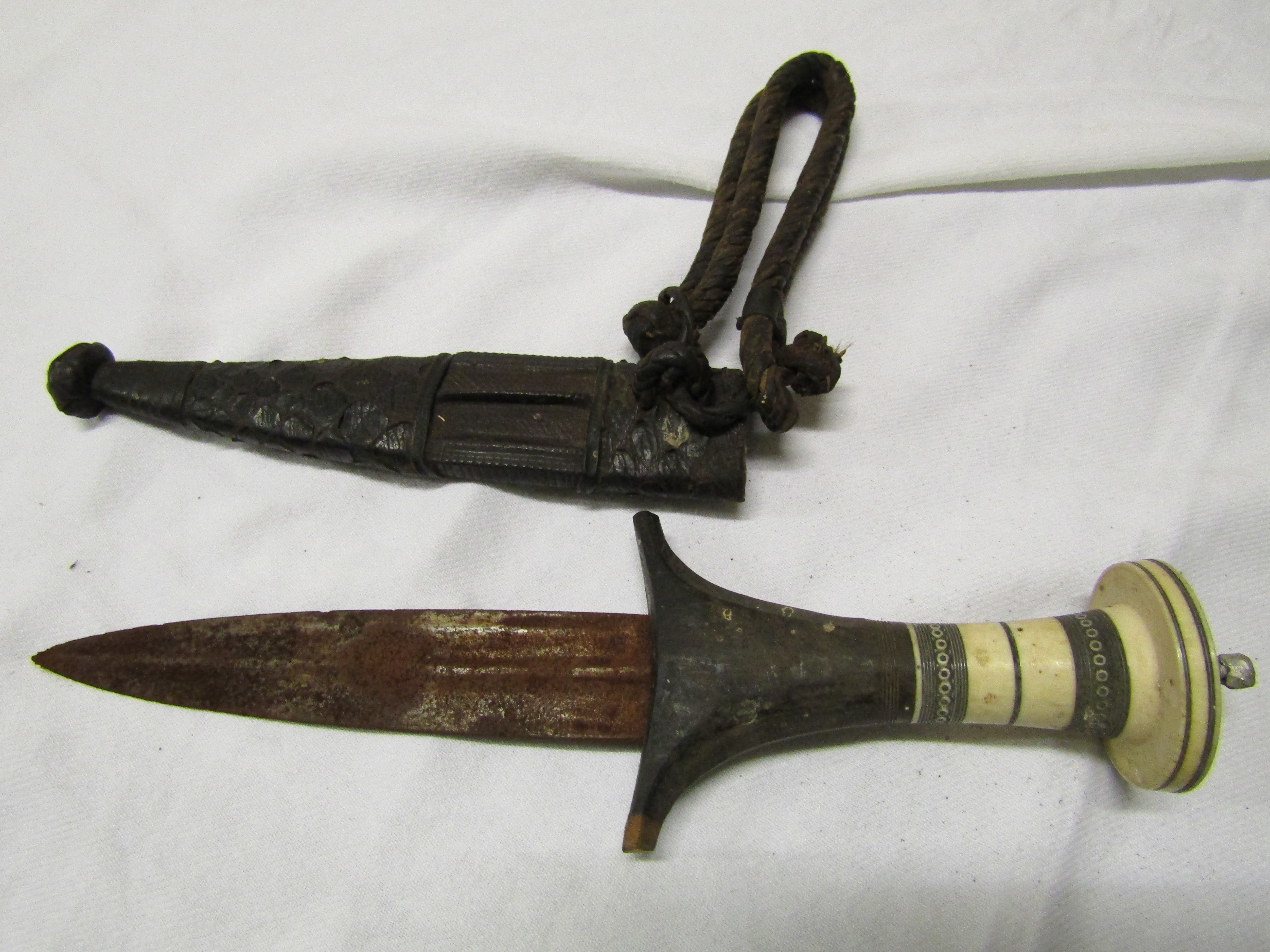 North African dagger with incised bone handle and crocodile sheath