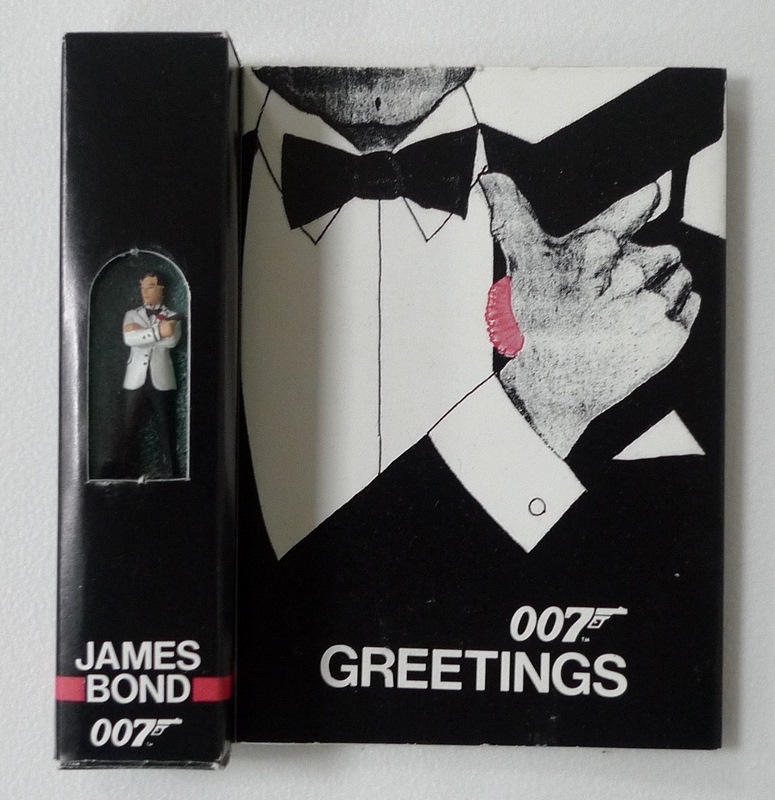 A collection of James Bond memorabilia, including a lead model of James ...