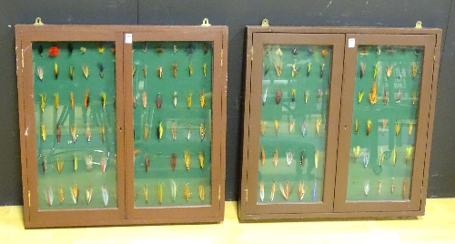A pair of glazed fly fishing display cases, displaying a collection of ...