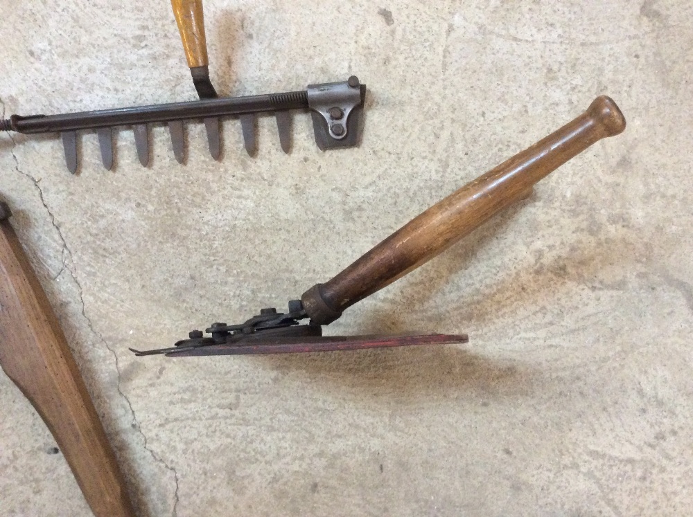 Three vintage thatching tools, including a "Crab" cutter